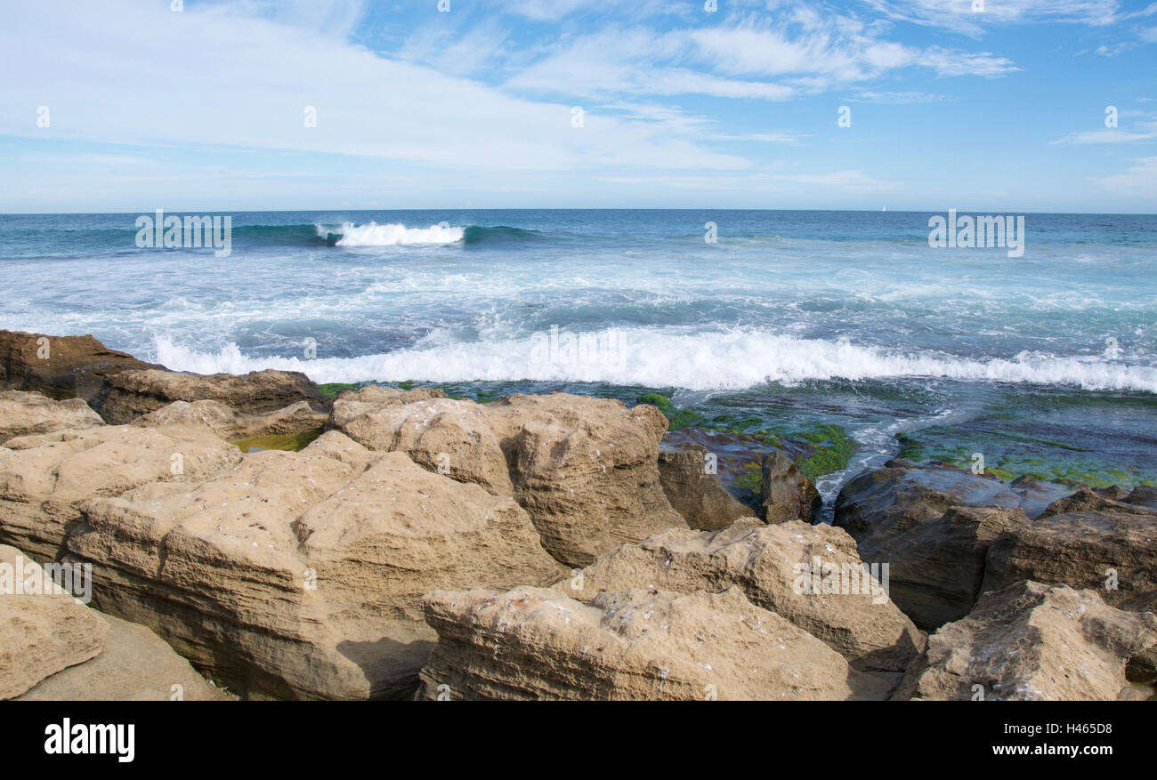 Limestone rock and Indian Ocean waters on the coast of Penguin Island ...