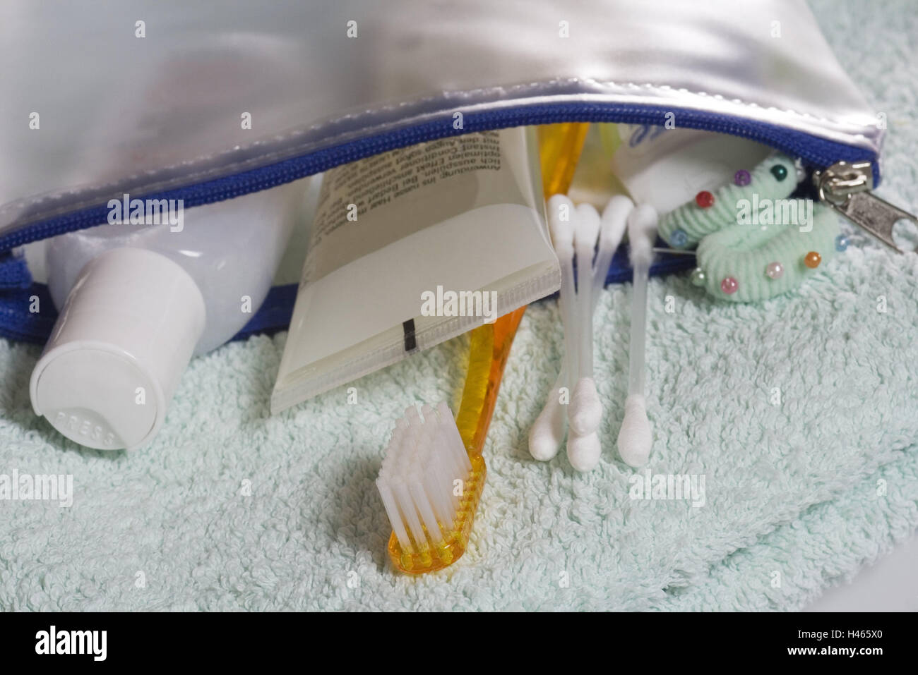 Sponge bags, opened, cosmetics article, towel, medium close-up, toilet ...