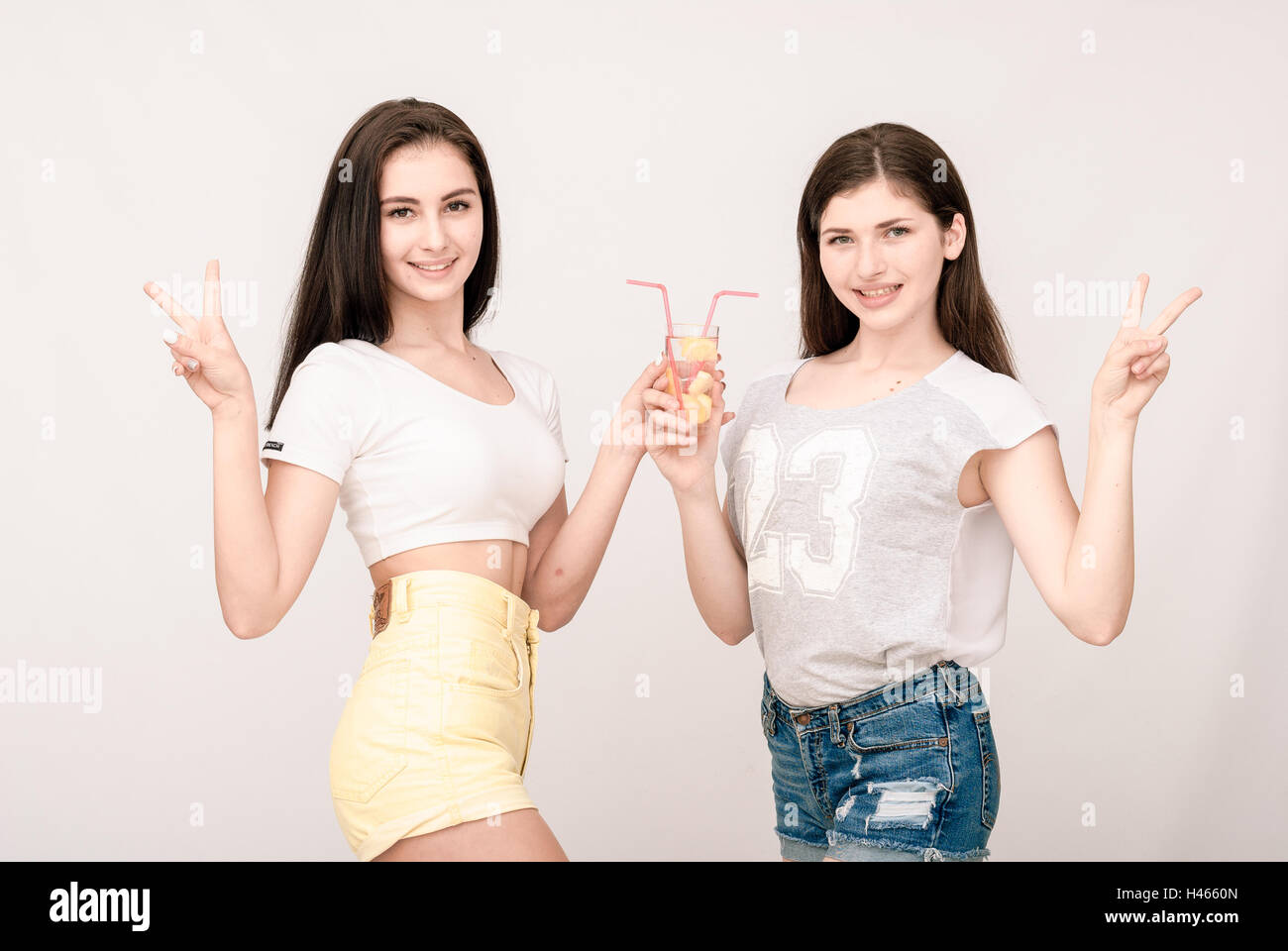 Positive friends portrait of two girls, funny faces, grimaces Stock ...