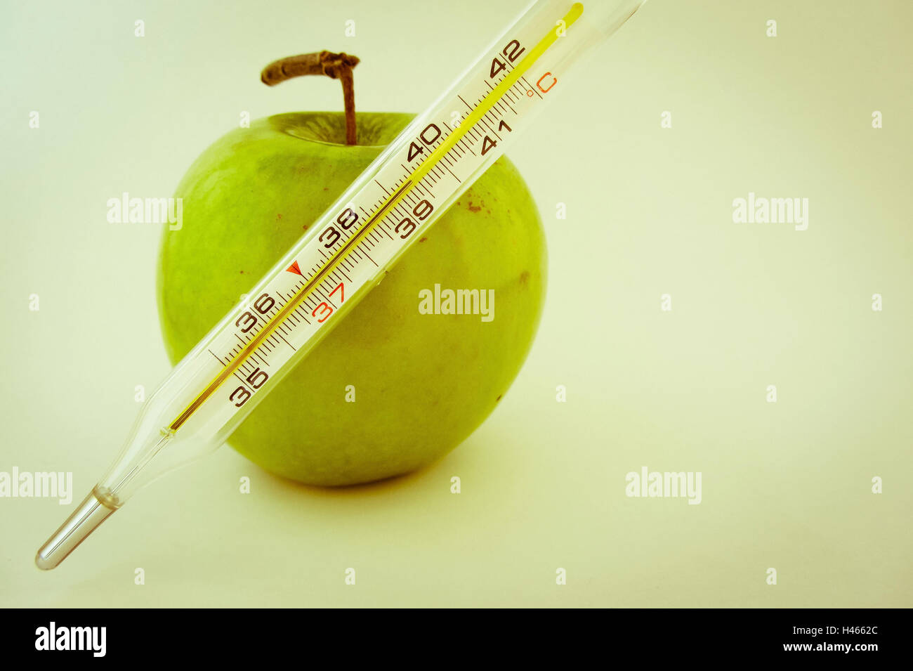 Green apple with thermometer Stock Photo - Alamy