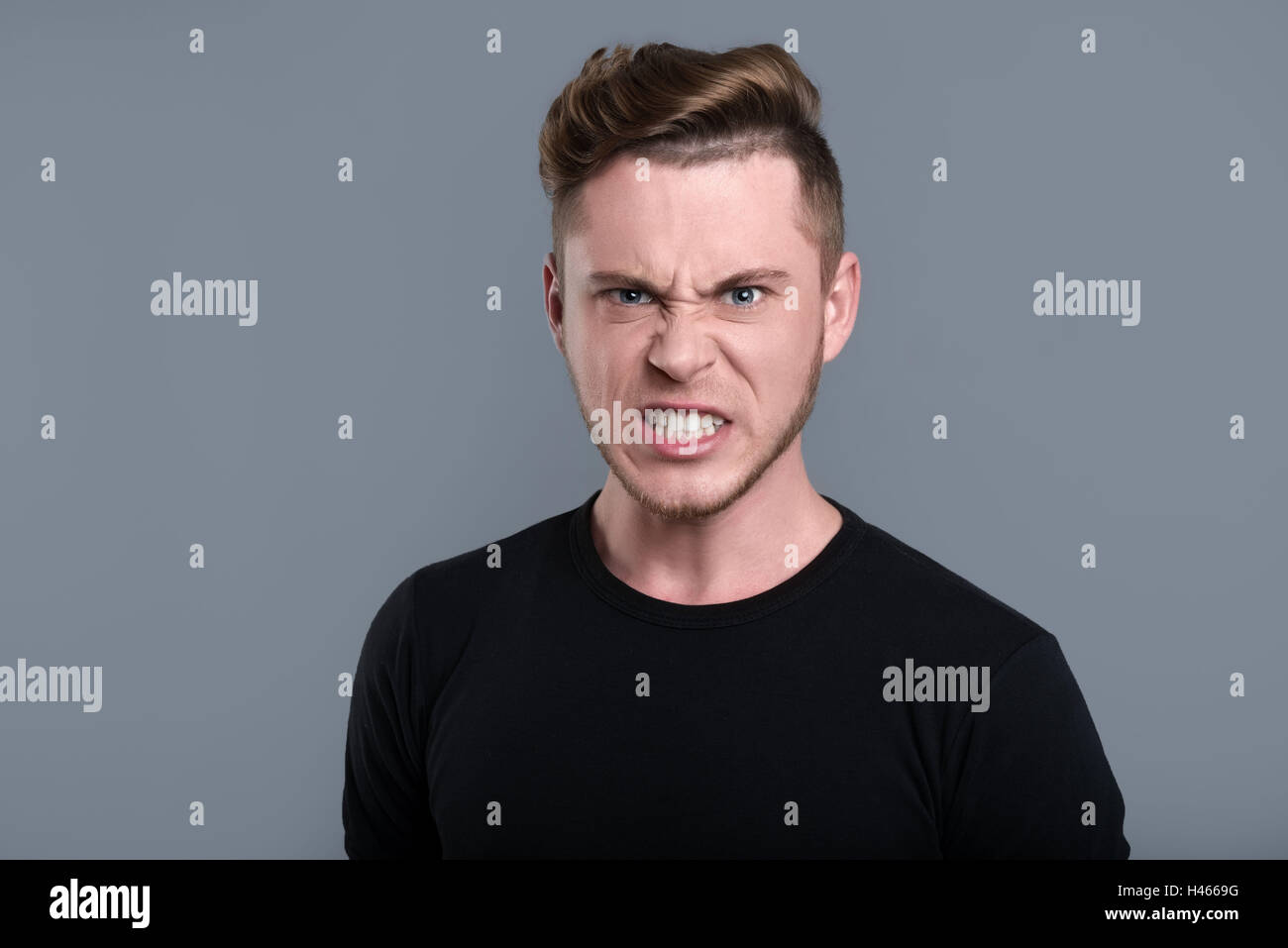 Choleric bearded young man Stock Photo - Alamy