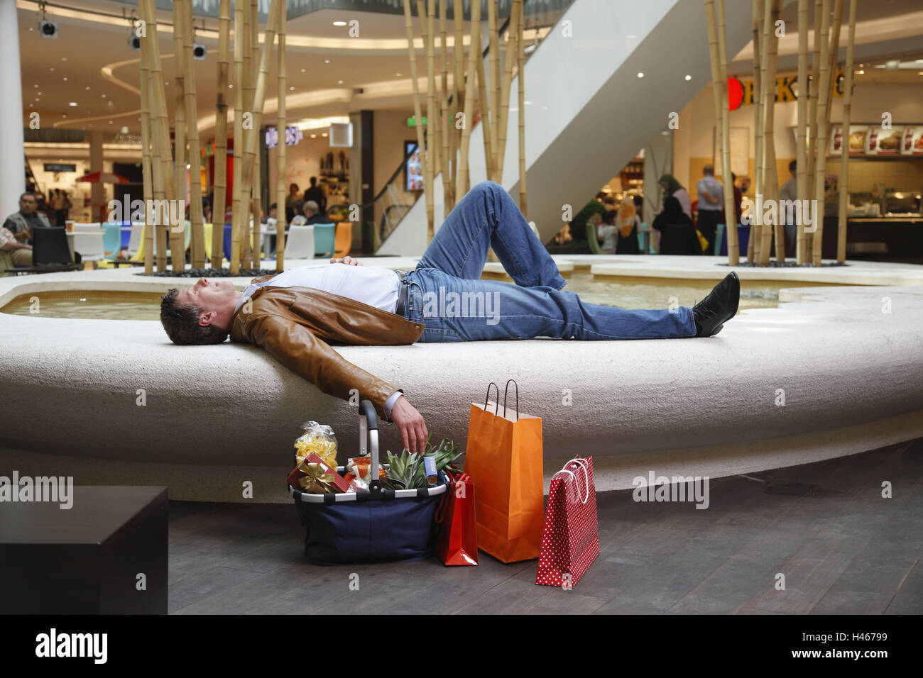 Shopping centre, man, lie, exhausts, well margin, carrier bags, economy ...