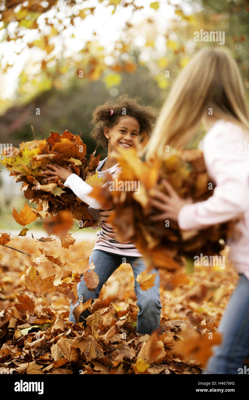 Girl, two, autumn leaves, play, throw, detail, blur, model released ...