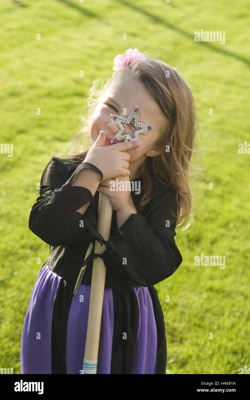 Girls, witch's costume, magic wand Stock Photo - Alamy