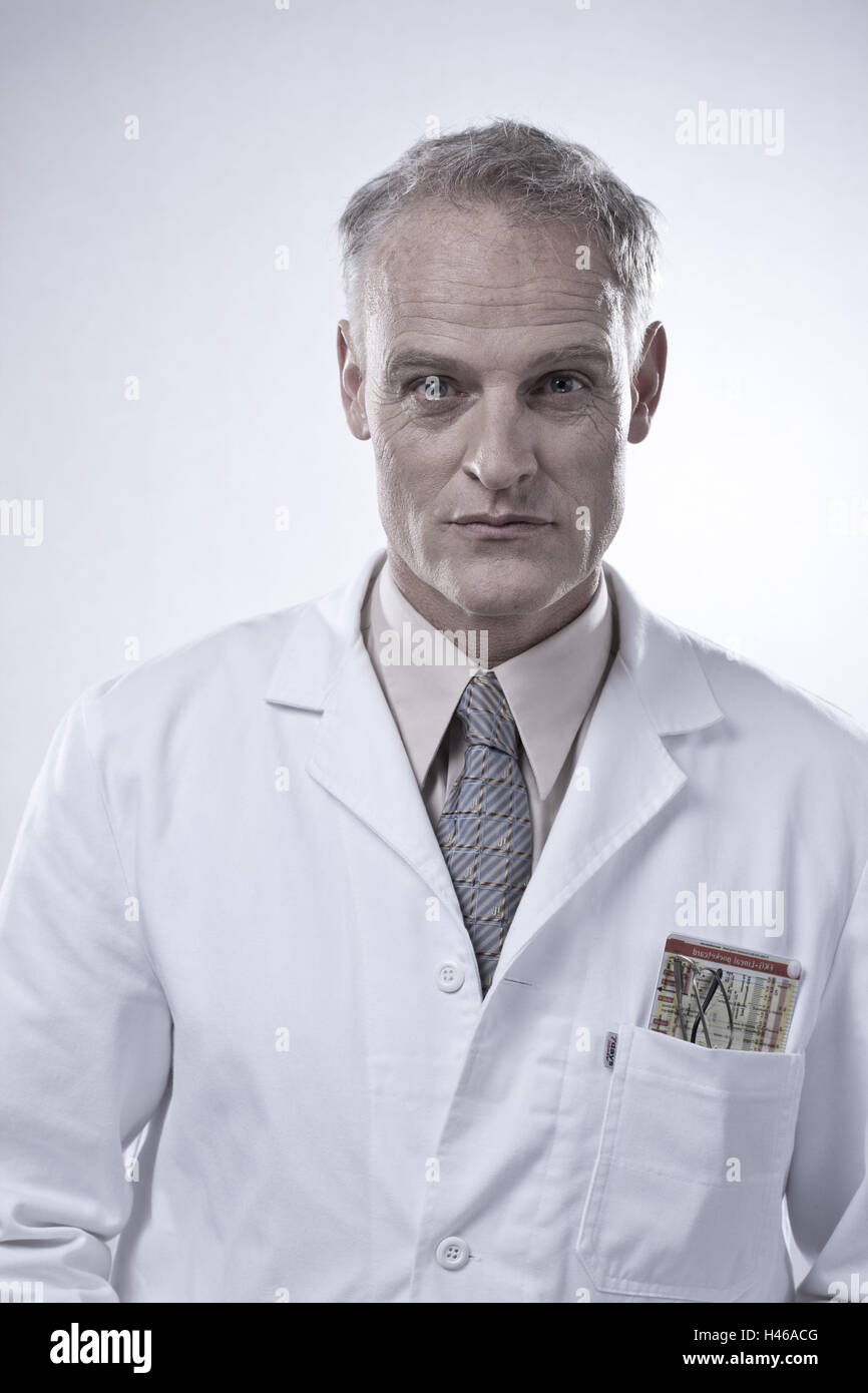 Doctor with smock and tie, portrait Stock Photo - Alamy