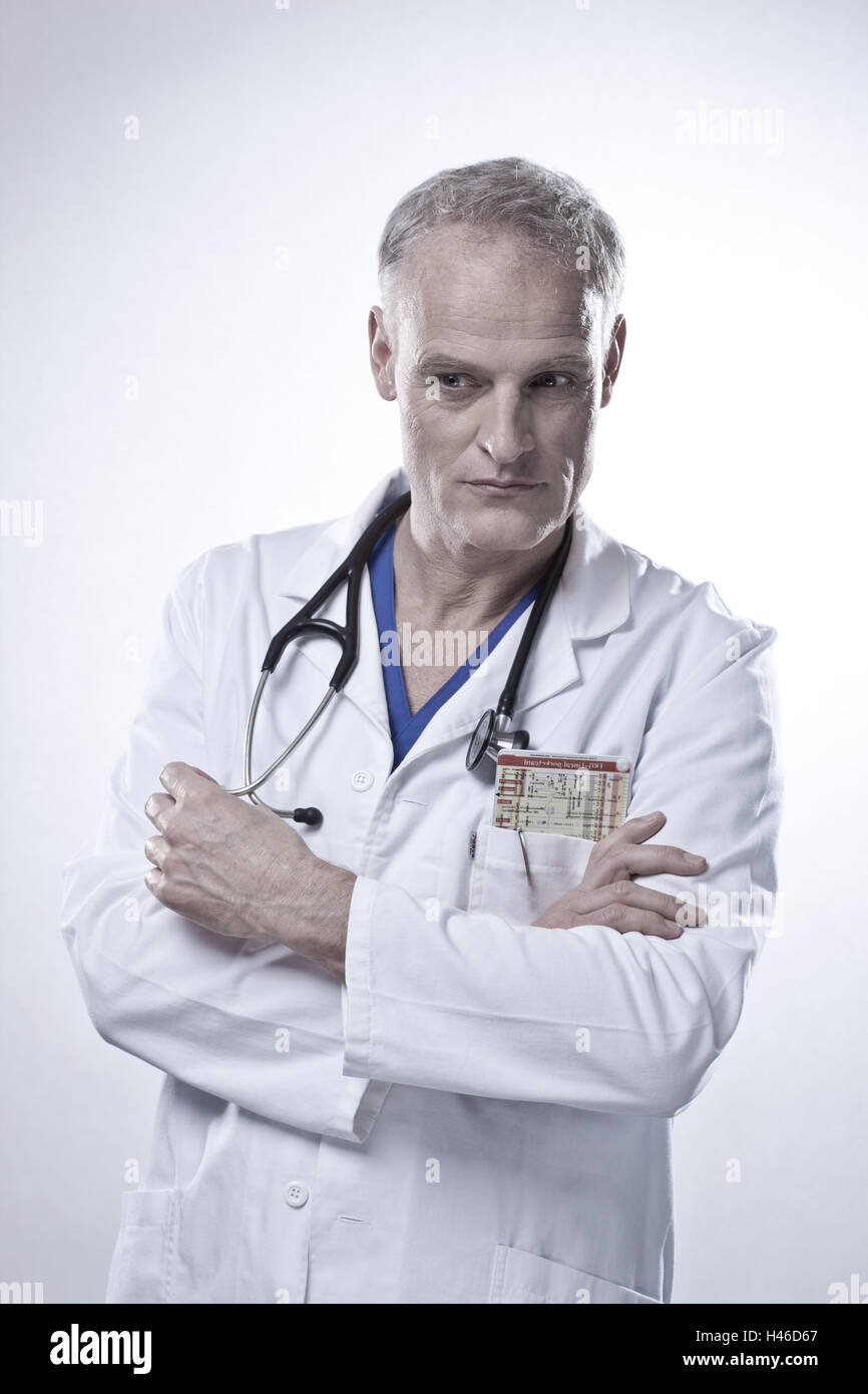 Doctor with stethoscope, thoughtful, arms crossed, half portrait Stock ...