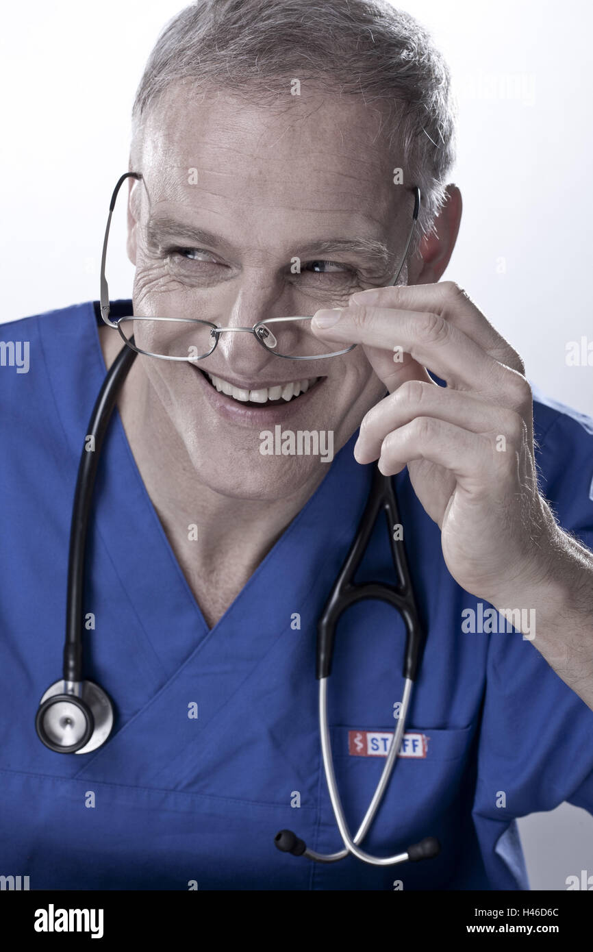 Op. doctor with stethoscope, laughing, puts on glasses, portrait Stock ...