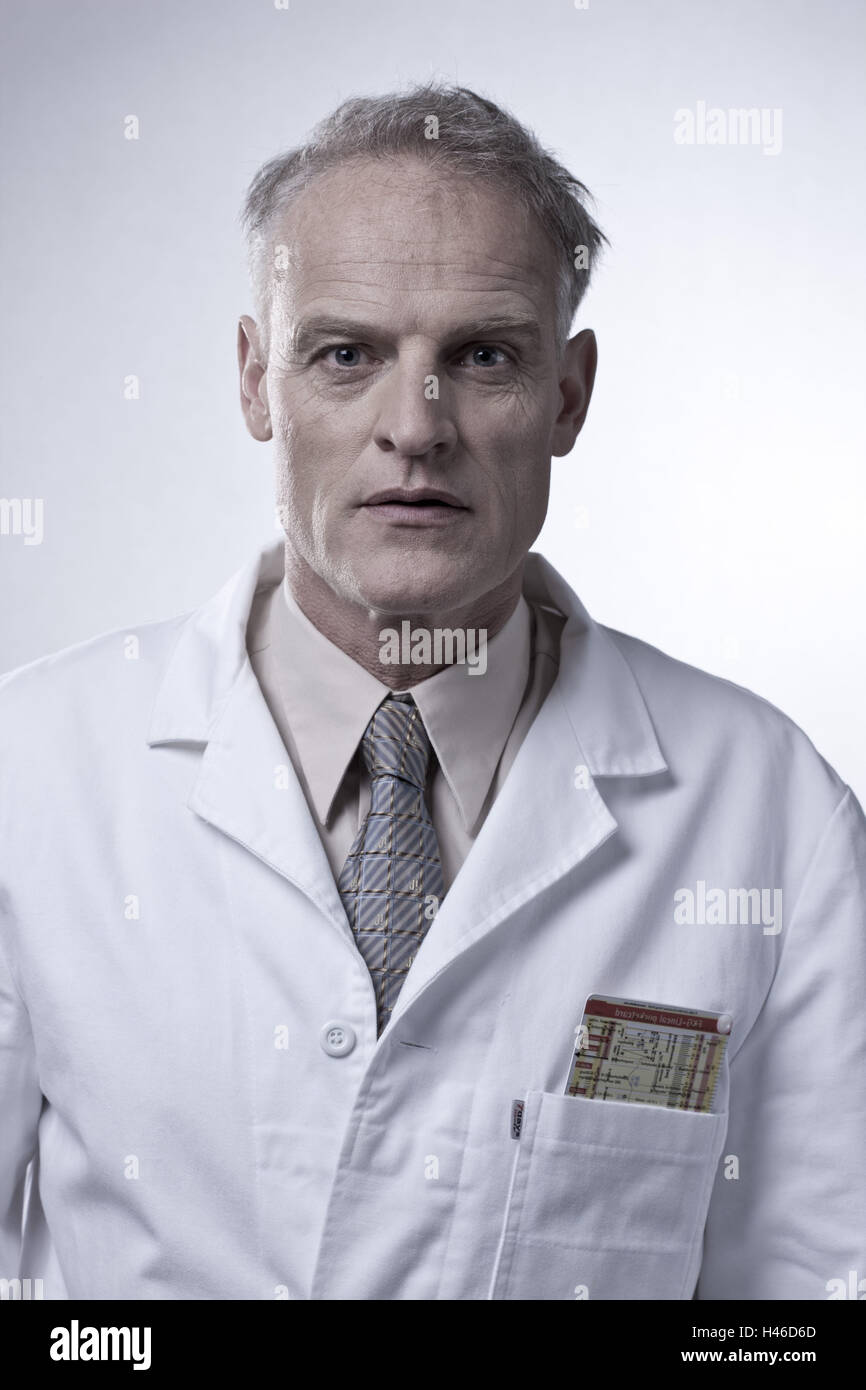 Doctor with smock and tie, portrait Stock Photo - Alamy