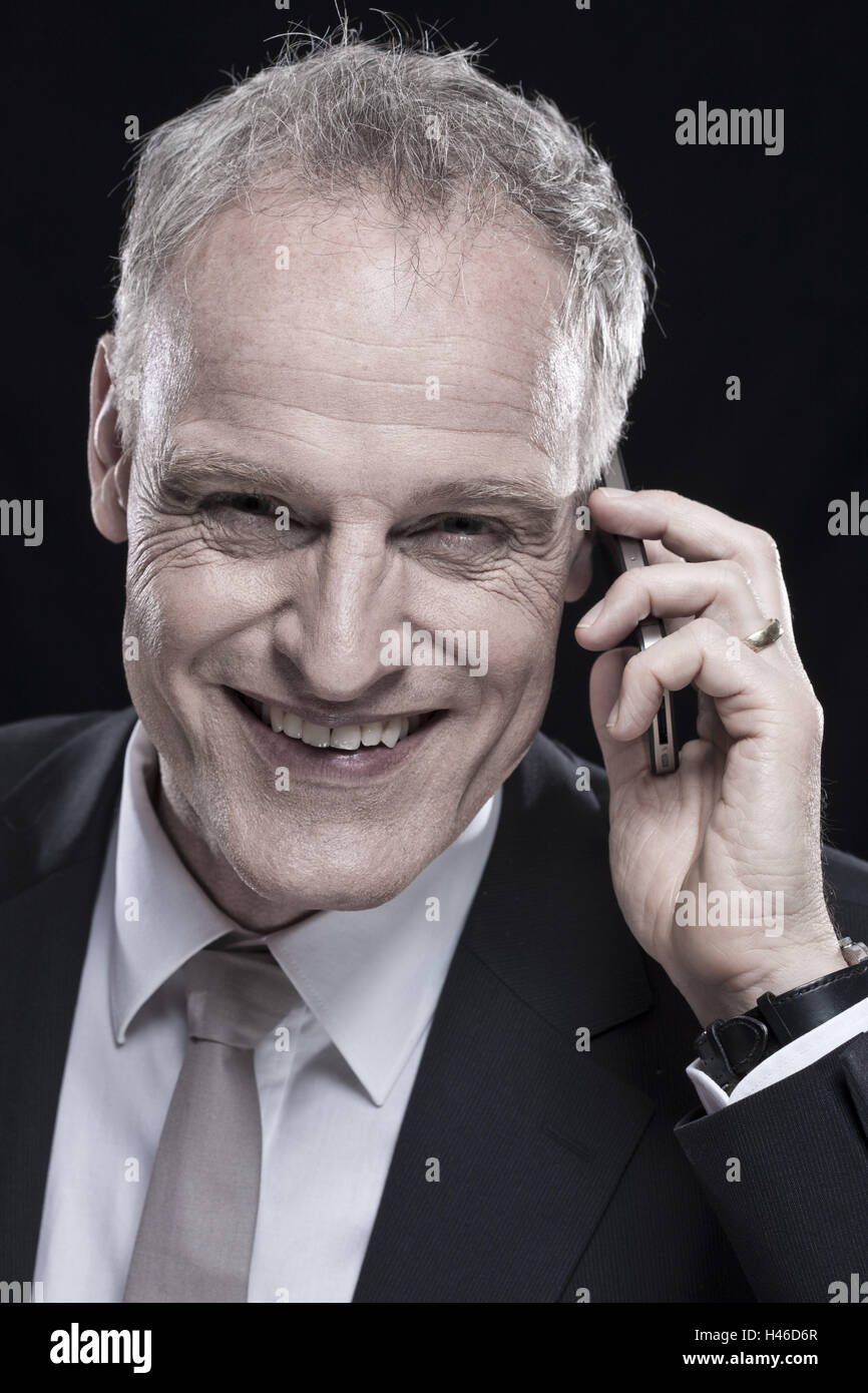 Businessman calls up mobile phone, smile, portrait Stock Photo - Alamy