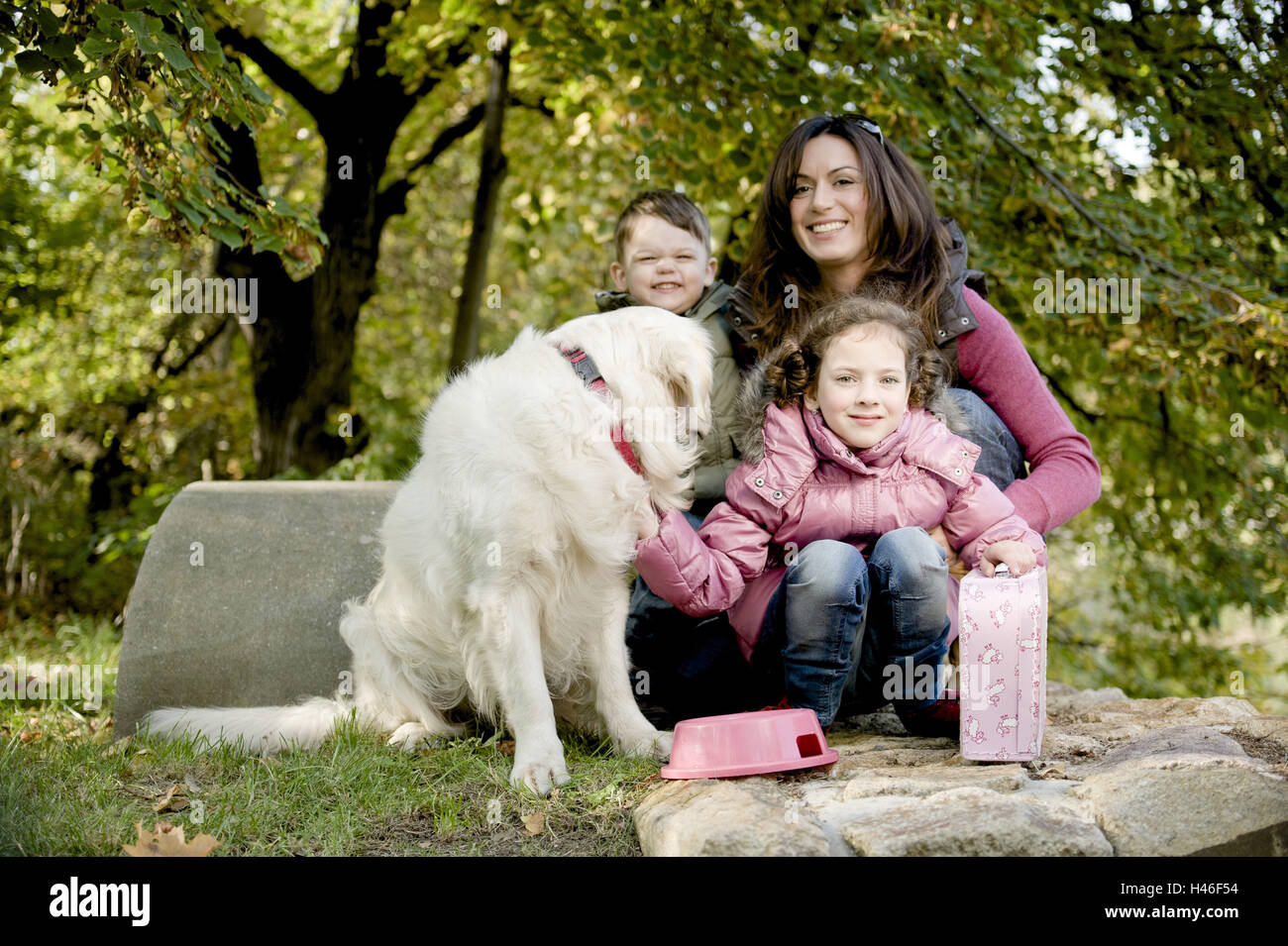Mother, two children and a dog Stock Photo - Alamy