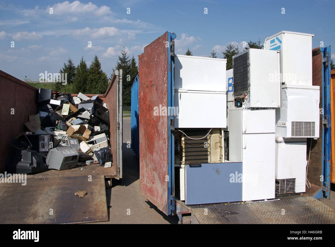 Electric waste, disused devices, garbage dump, container Stock Photo ...