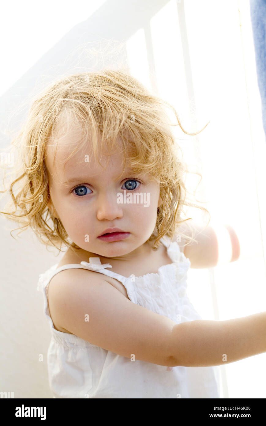 Toddler, girl, serious, summer dress, portrait Stock Photo - Alamy