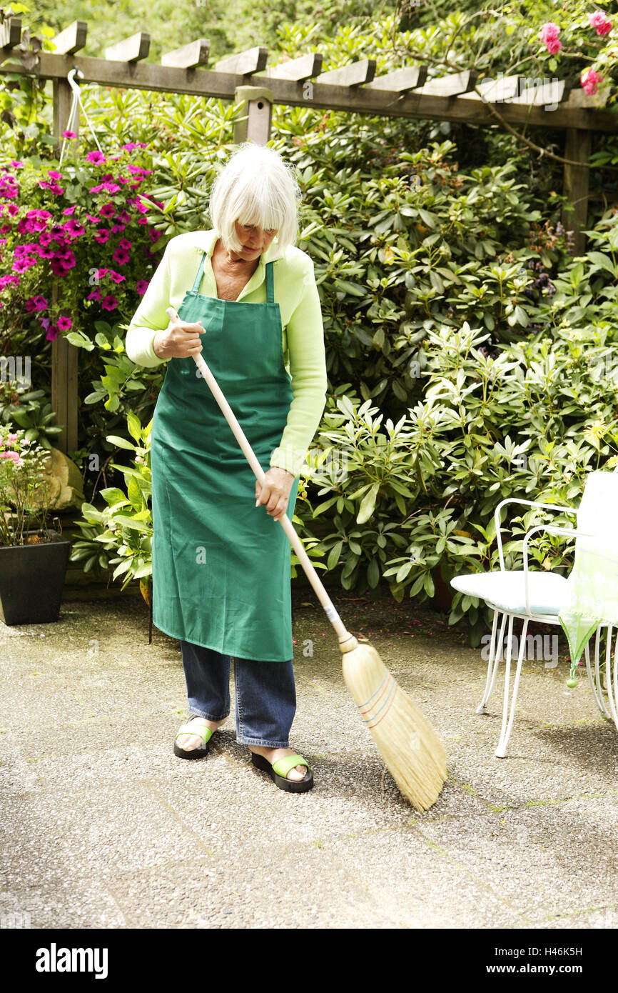 older person, female, apron, Terrace, broom, sweep, model released ...