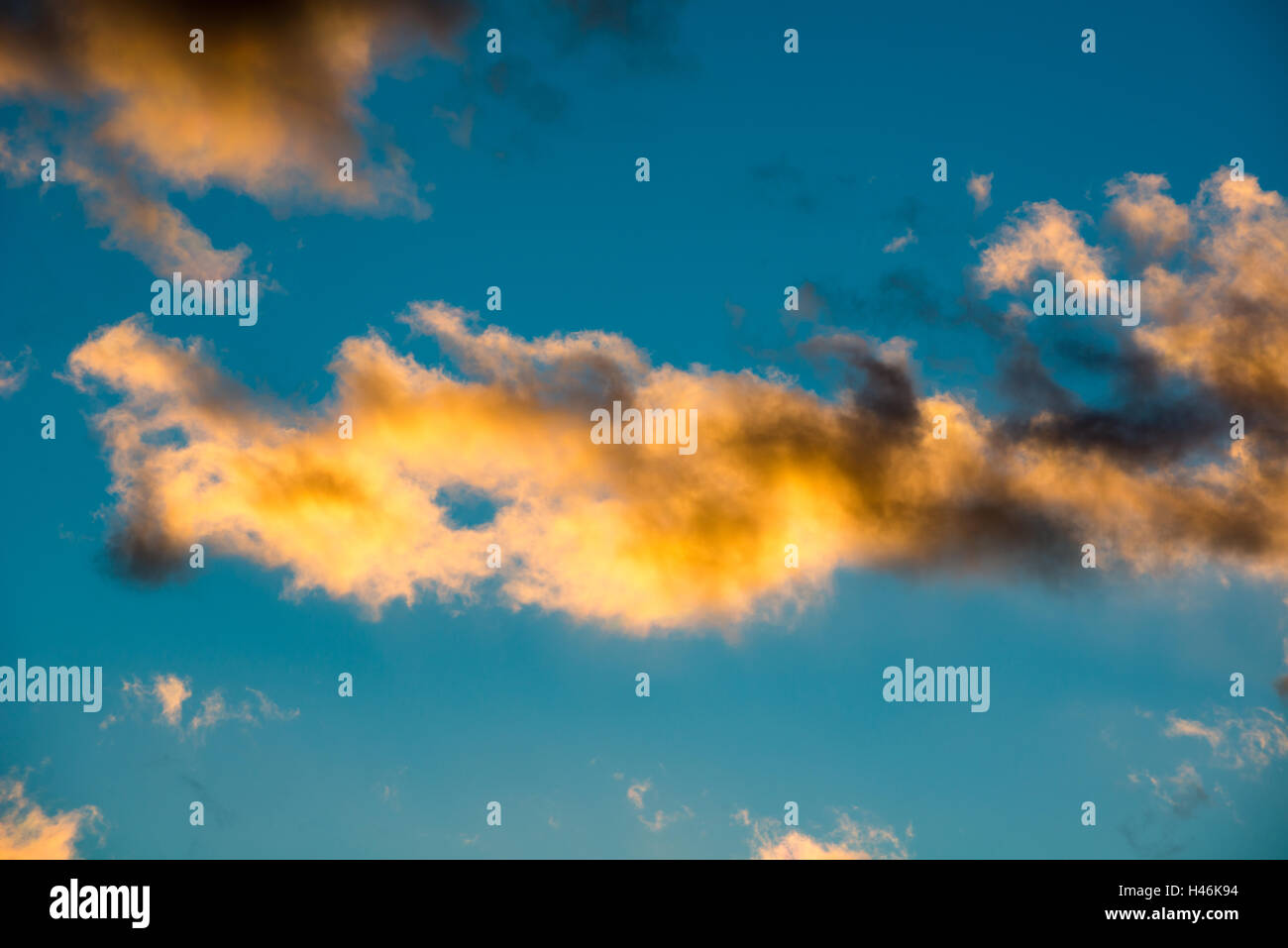 Puffy and colorful sunset clouds Stock Photo - Alamy