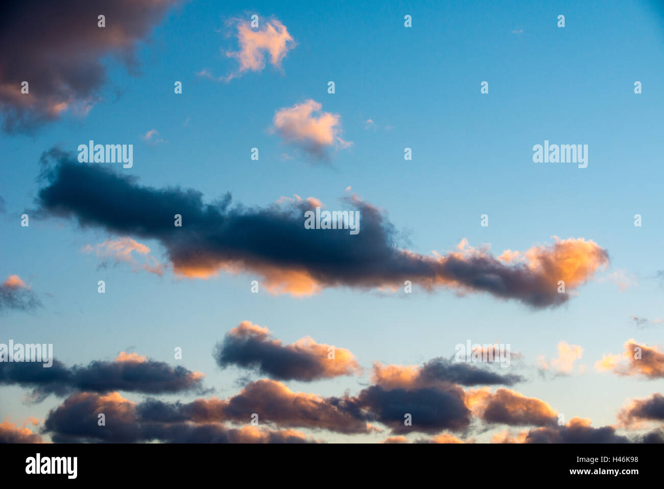 Puffy and colorful sunset clouds Stock Photo - Alamy
