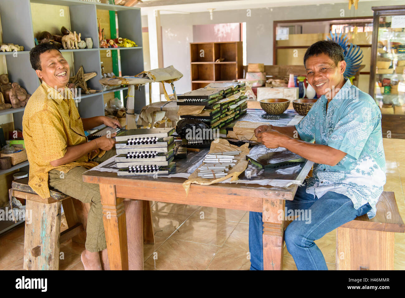 Man sitting on table working for fair trade company Stock Photo - Alamy