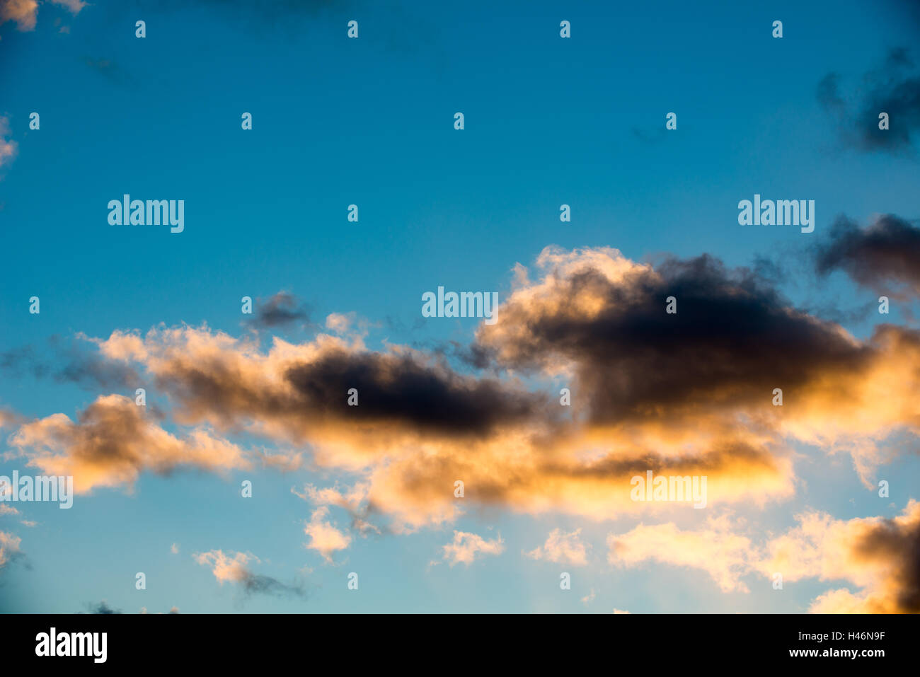 Puffy and colorful sunset clouds Stock Photo - Alamy