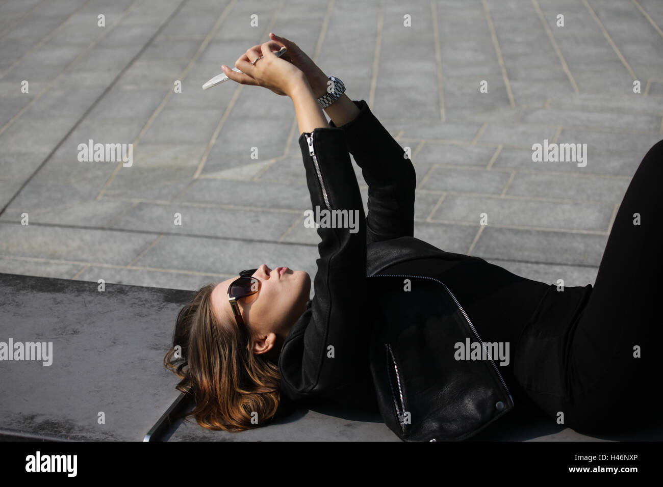 Young beautiful woman taking a selfie in the city Stock Photo - Alamy