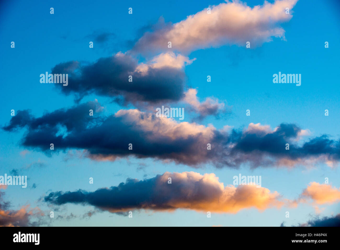 Puffy and colorful sunset clouds Stock Photo - Alamy