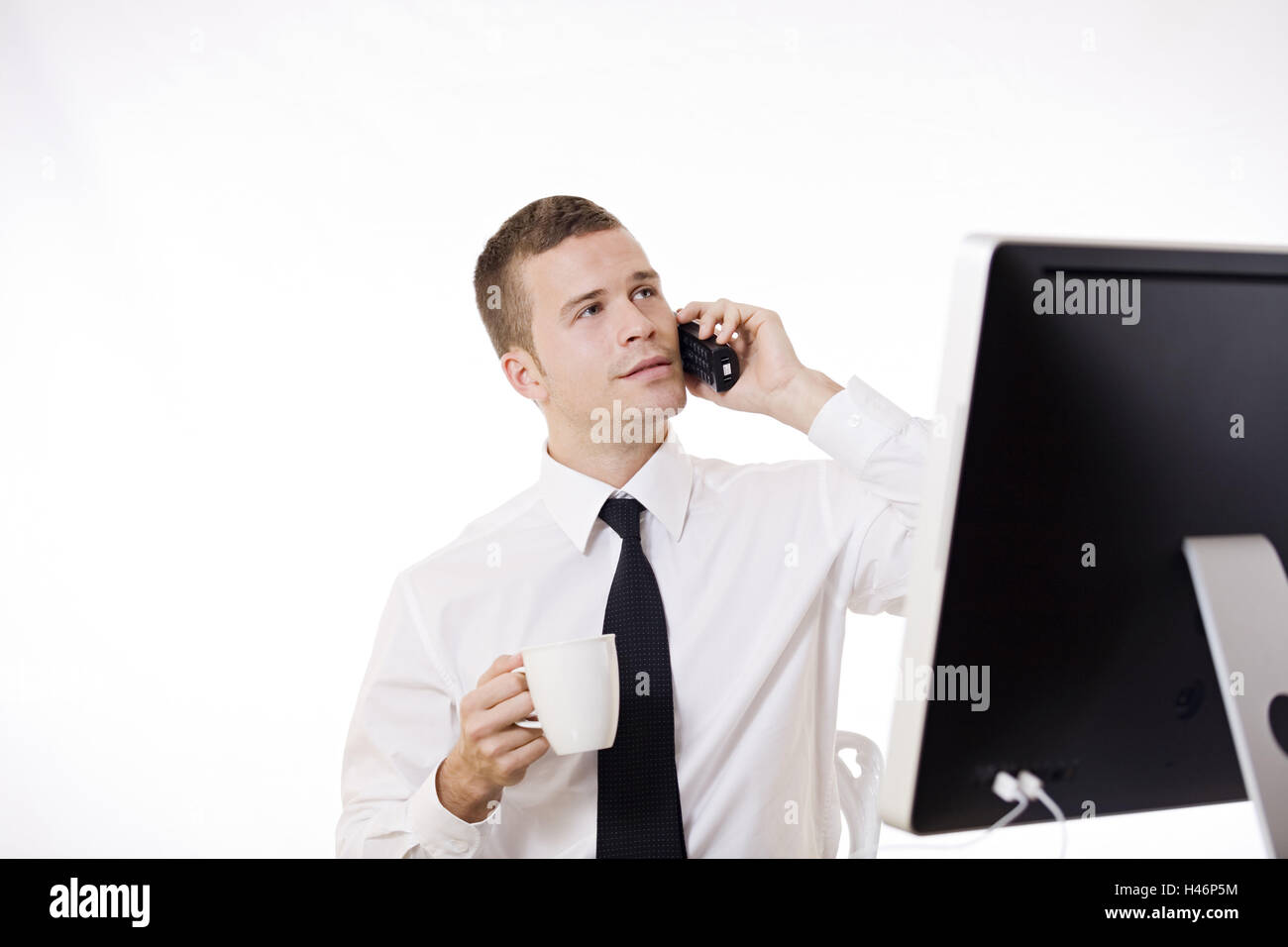 Businessman, office, desk, sit, coffee cup, mobile phone, call up Stock ...