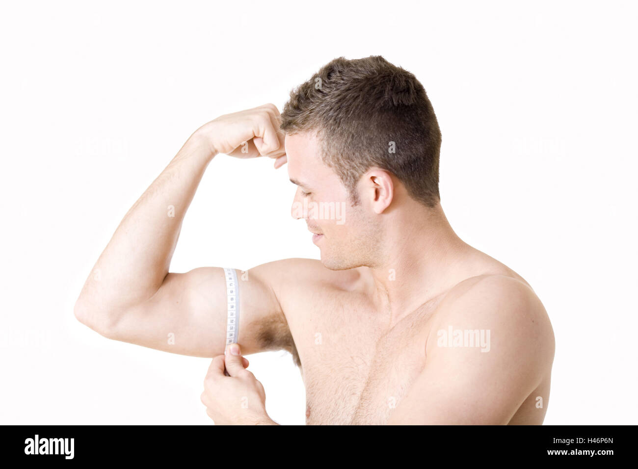 Man, tape measure, biceps measure Stock Photo - Alamy