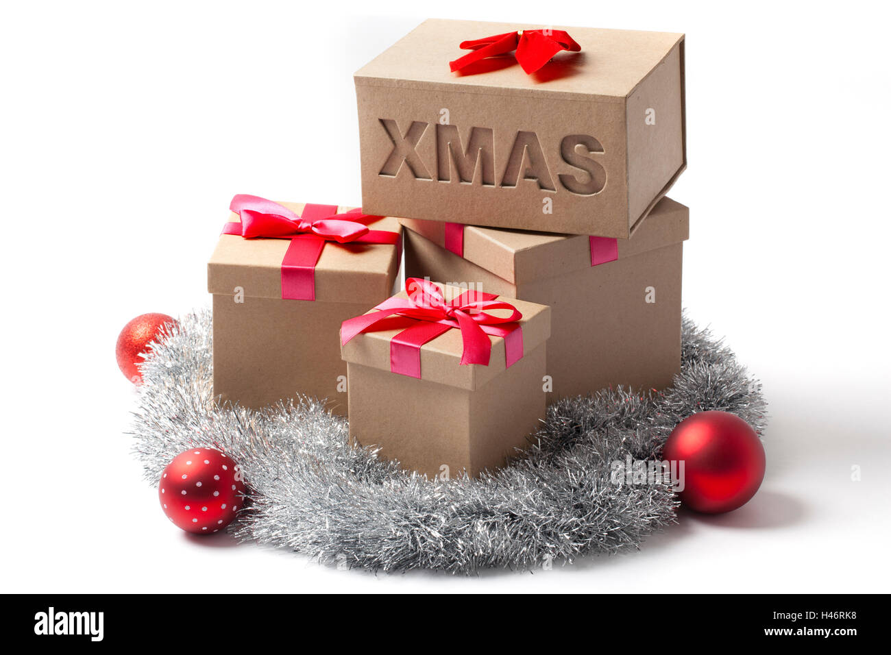 Several gift boxes Christmas tree balls and tinsel garland isolated on ...