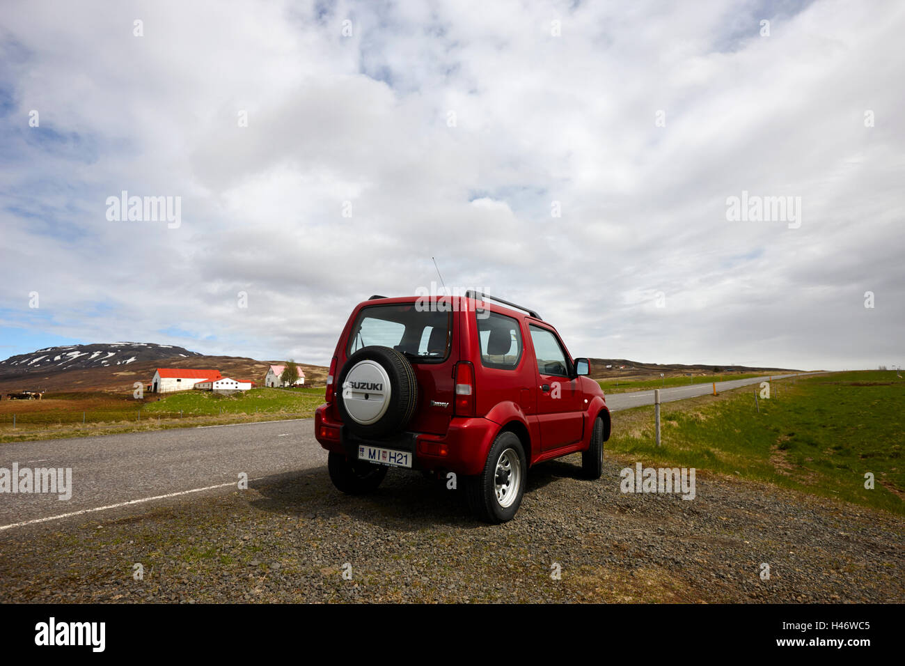 Suzuki jimny 4x4 off road hire car parked by the side of the road ...