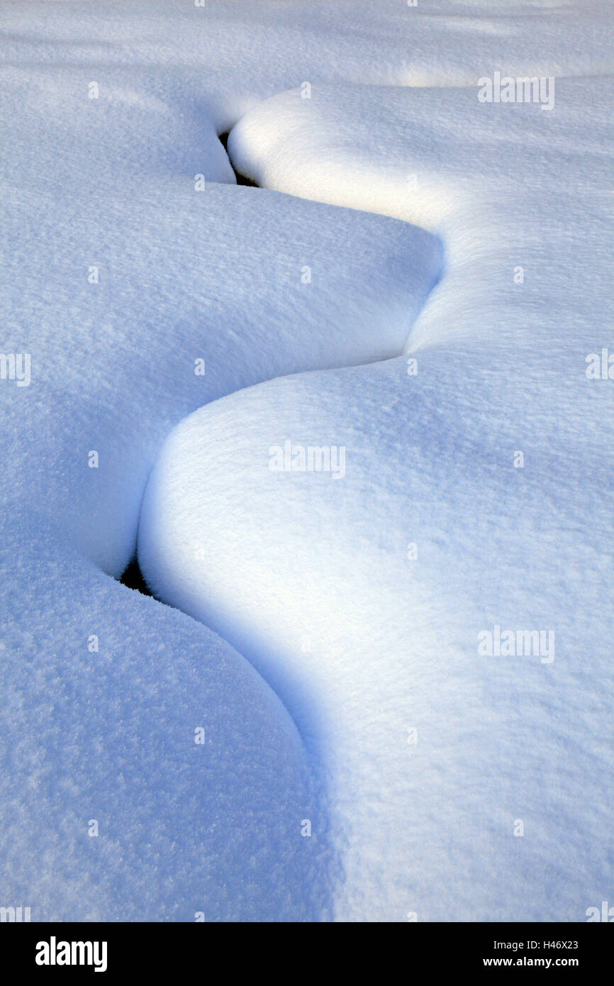 Snow caps with thin stream course Stock Photo - Alamy