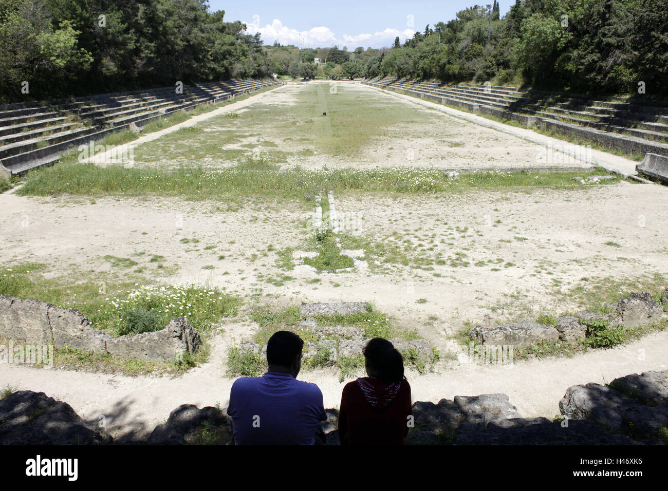 Greece, Rhodes, stadium, antiquity, locals, back view Stock Photo - Alamy