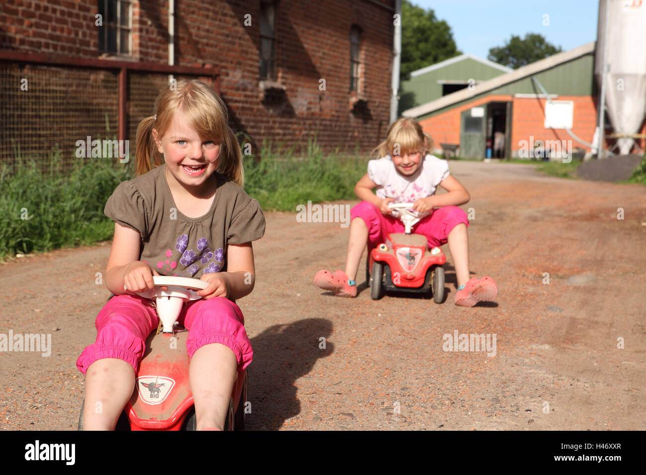 Farm, two playing girls Stock Photo - Alamy