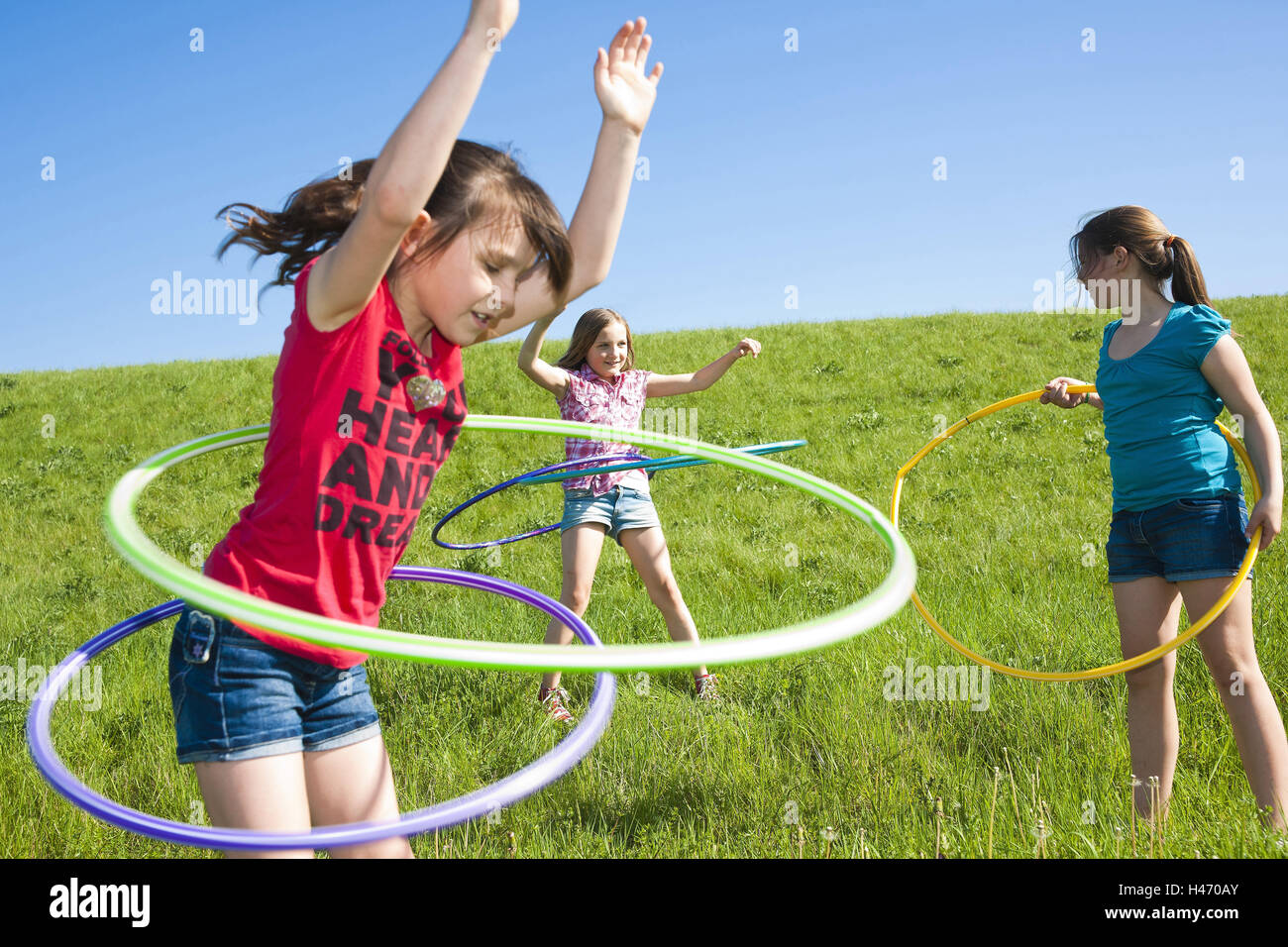 Hula hoop game children hi-res stock photography and images - Alamy