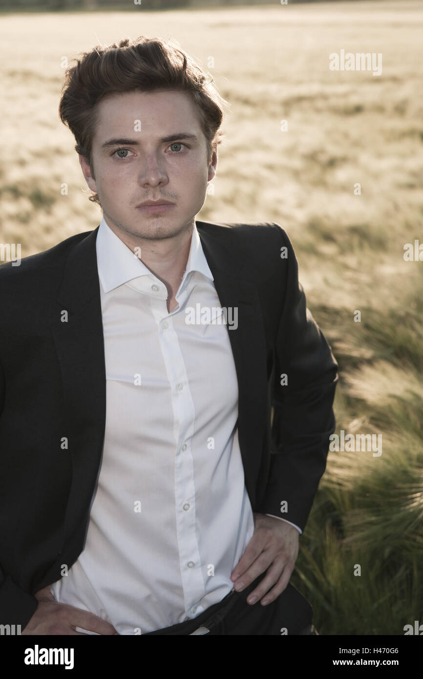 Young man stands in grain field hi-res stock photography and images - Alamy