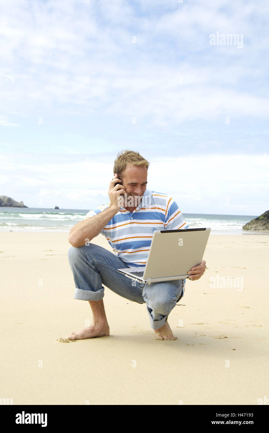 Beach, man, smile, mobile phone, call up, laptop, squat, person, sandy ...