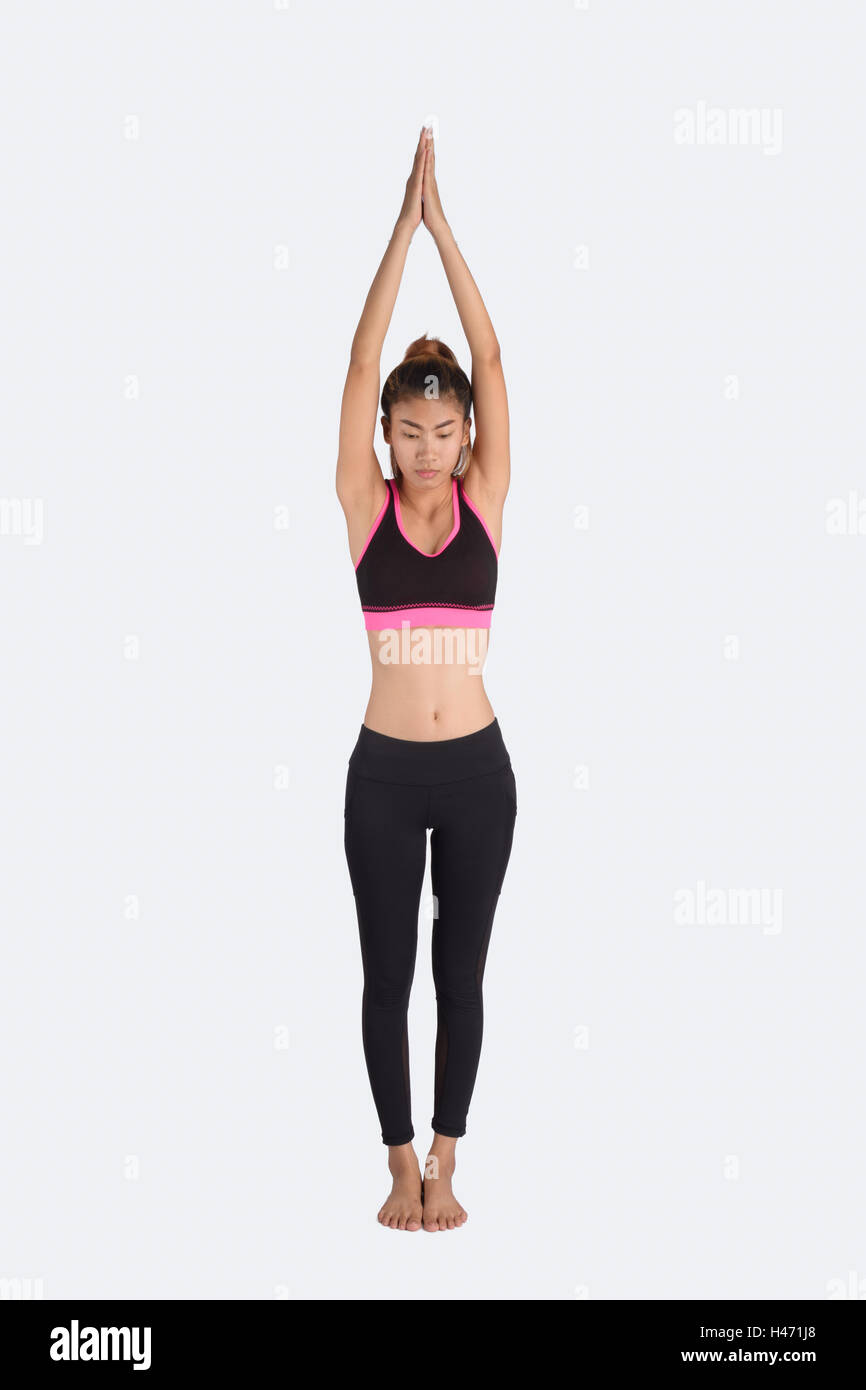 Girl in yoga stance on isalated white studio background Stock Photo - Alamy