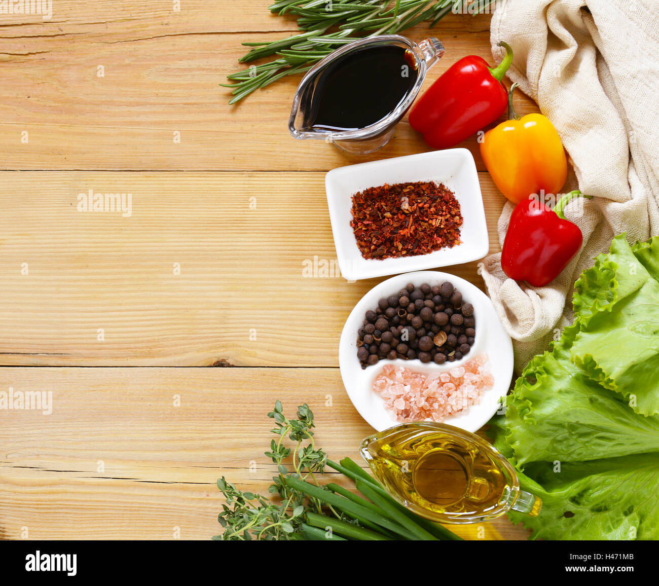 herbs, spices and sauces on wooden background Stock Photo - Alamy