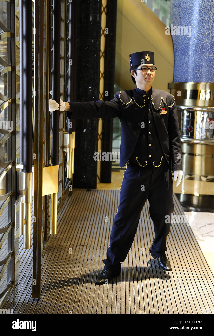Man, doorkeeper, hotel door, Macau, China Stock Photo - Alamy