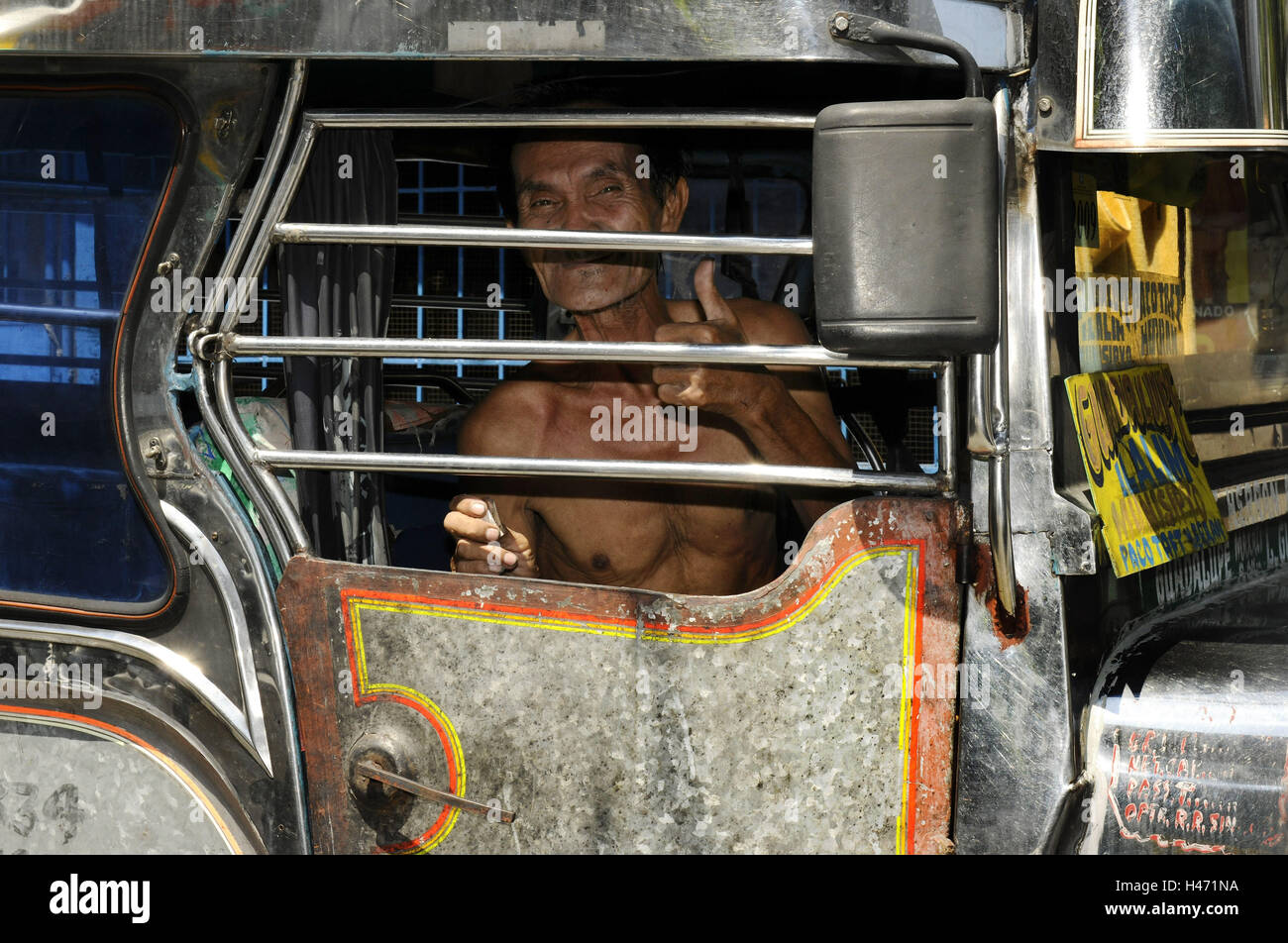 Man, vehicle, jeepney, transport, Manila, the Philippines Stock Photo ...