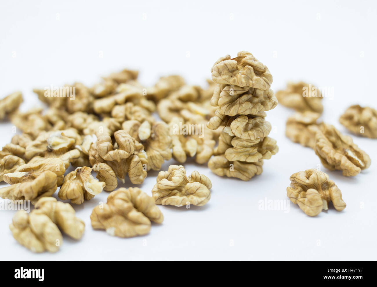 Lots of walnuts on white background Stock Photo - Alamy