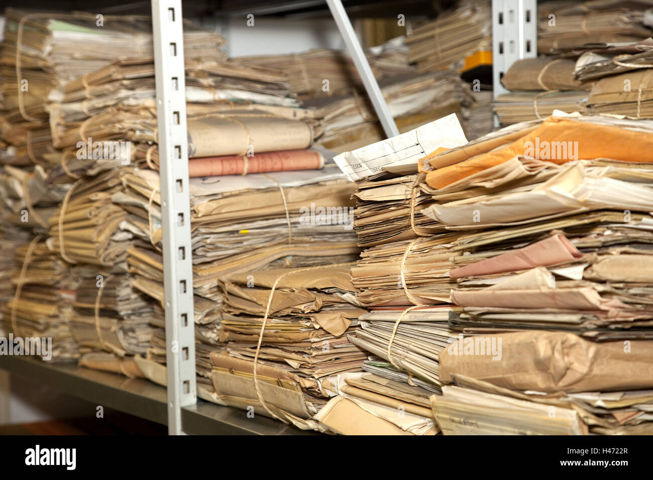 Shelf, pile of documents Stock Photo - Alamy