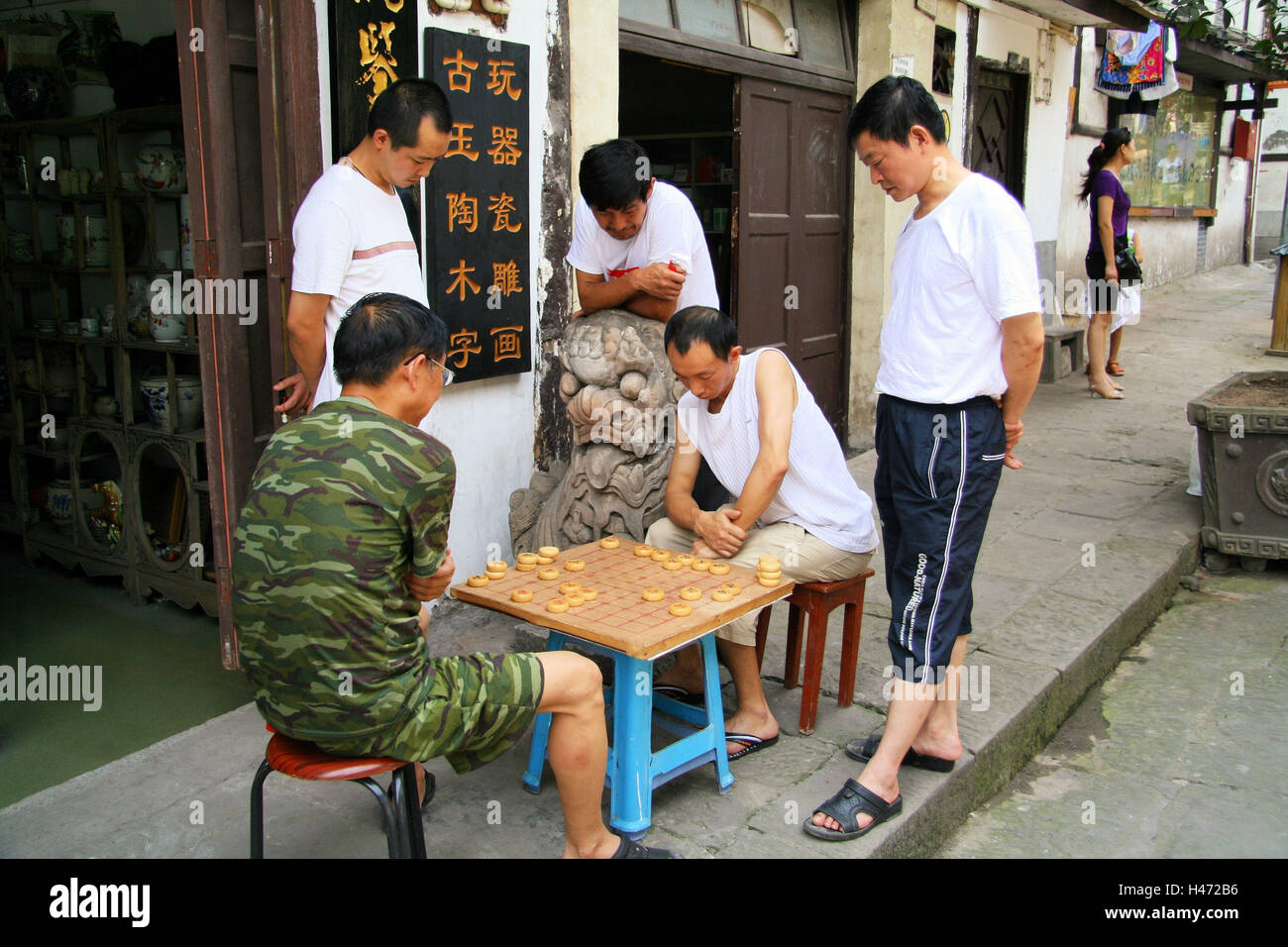 China, Chongqing, street scene, men with the Majong game Stock Photo ...