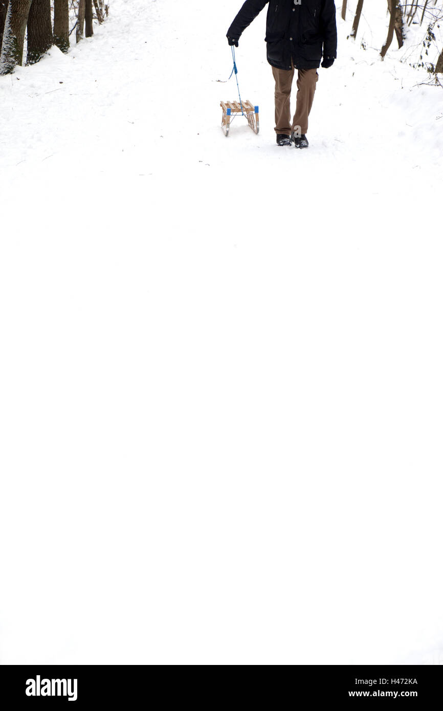 Man, tobogganing, pulling sledge Stock Photo - Alamy