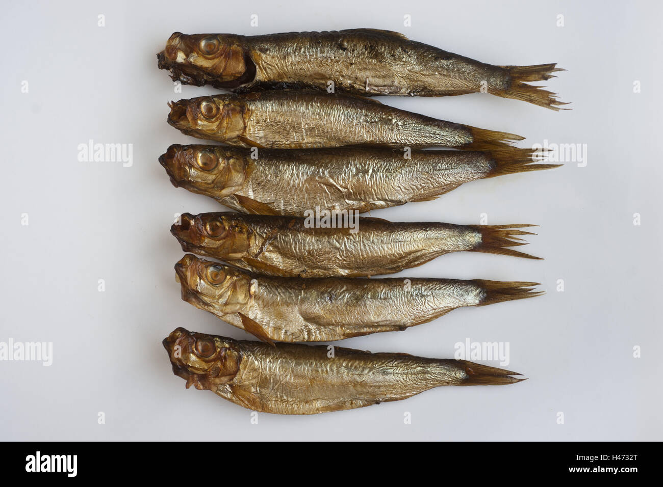 Sprats, smoked, sea fish, fish, side by side, medium close-up, loaf of ...