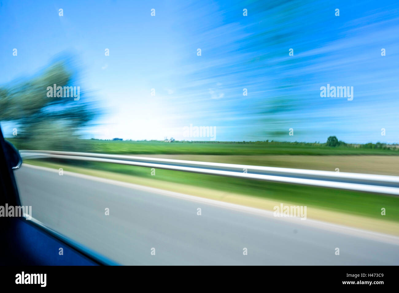 Blurred highway scene from a car window Stock Photo - Alamy