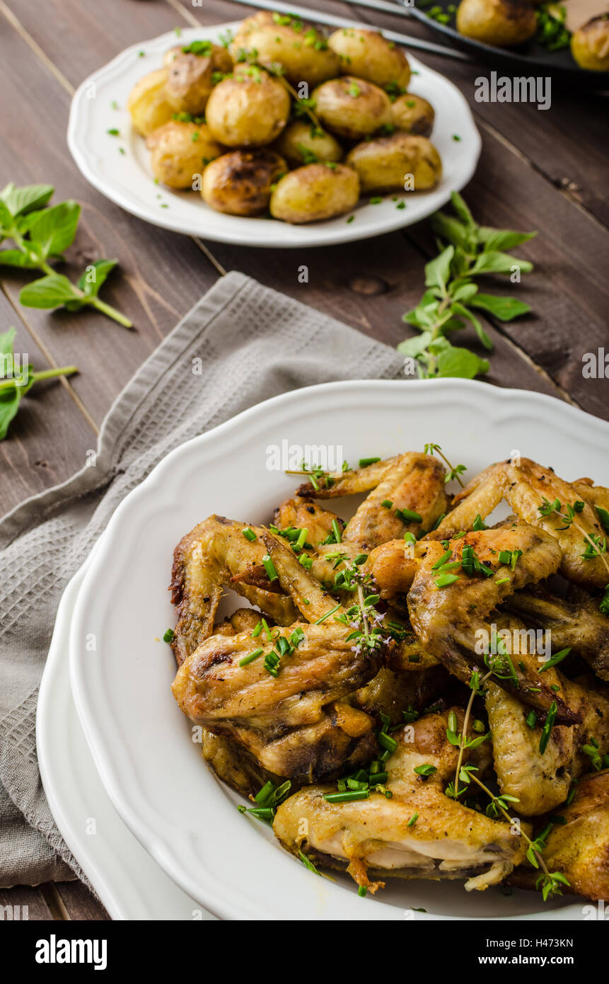 Roasted chicken wings with new potato - potato roasted in country style ...