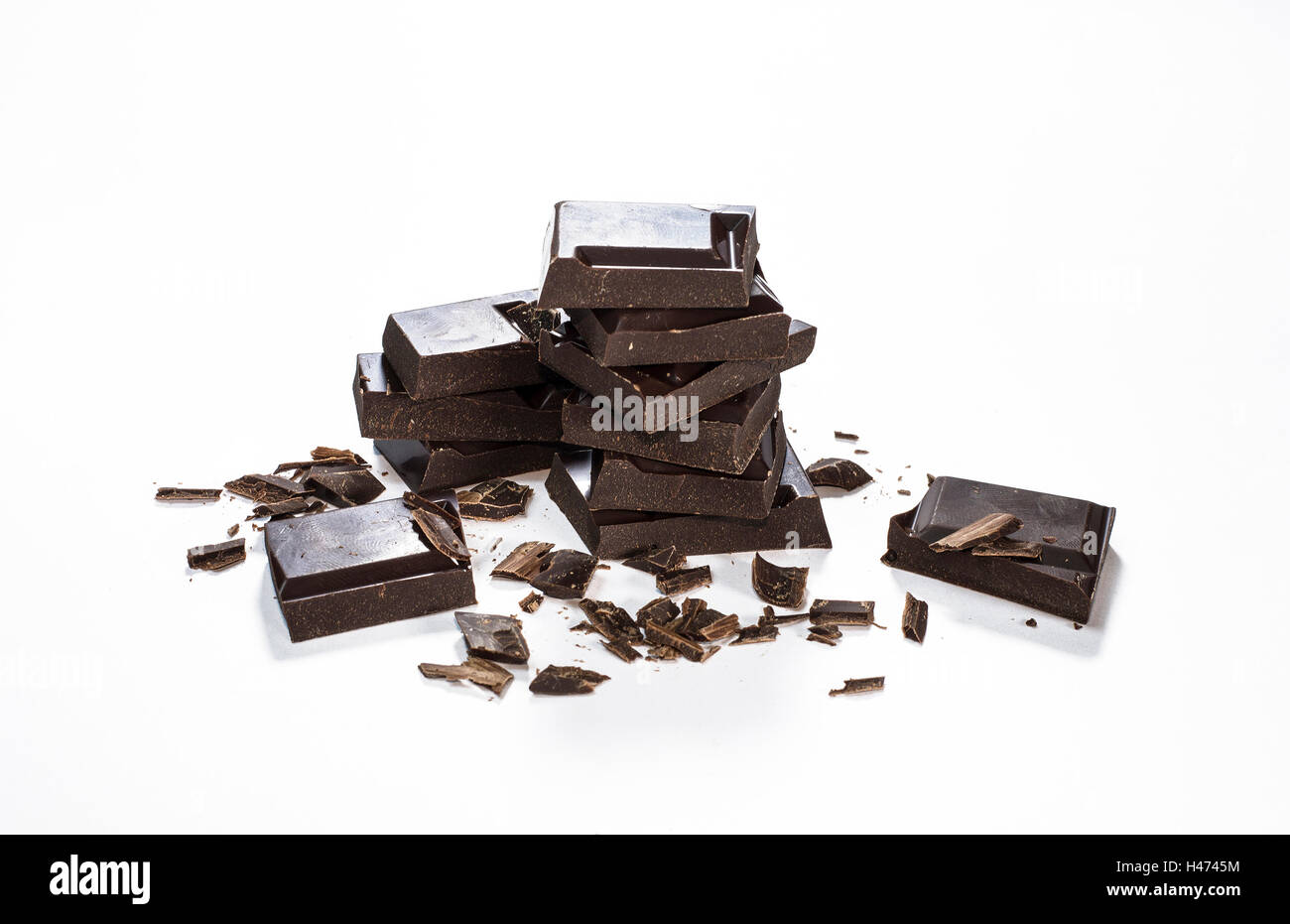A pile of broken dark chocolate pieces Stock Photo - Alamy