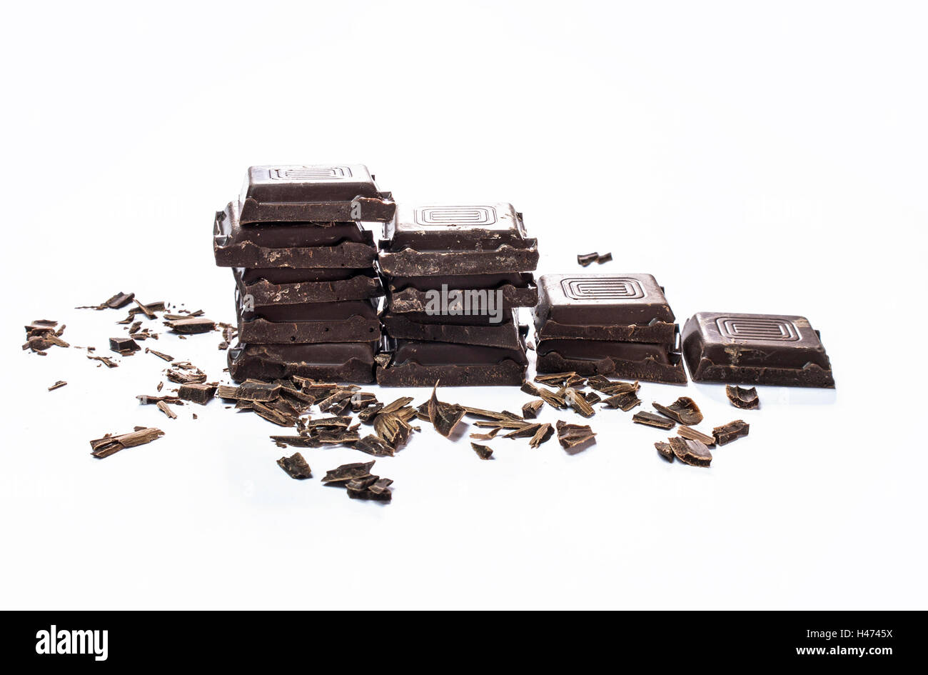 A pile of broken dark chocolate pieces Stock Photo - Alamy