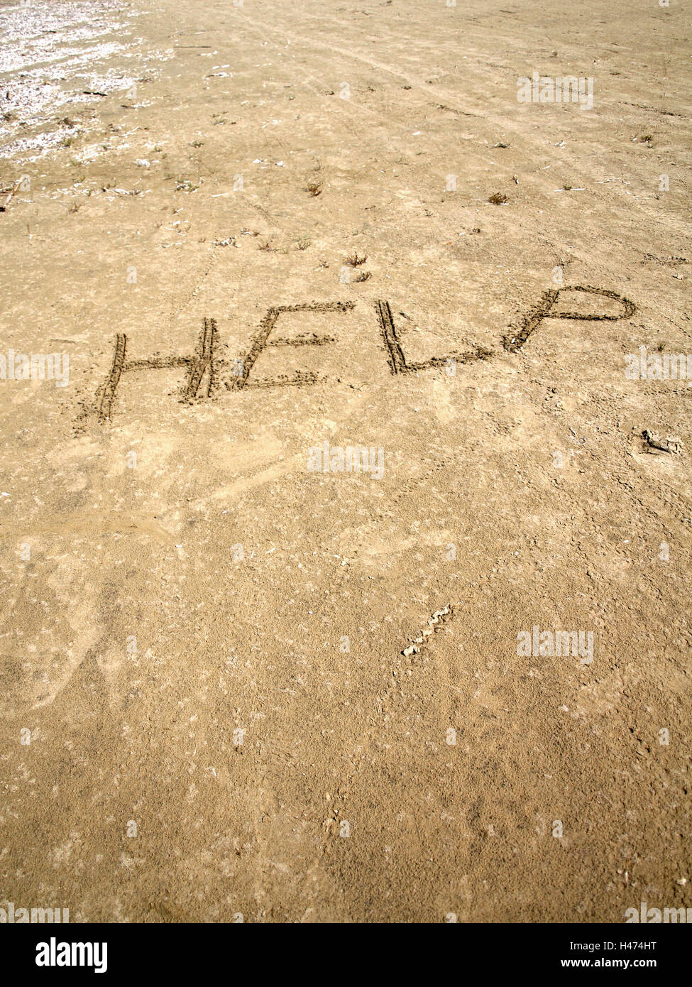 Help written in sand at Agnos Beach, Corfu Greece Stock Photo - Alamy