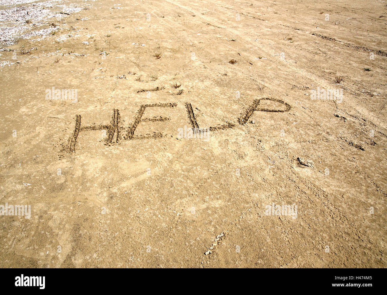 Help written in sand at Agnos Beach, Corfu Greece Stock Photo - Alamy