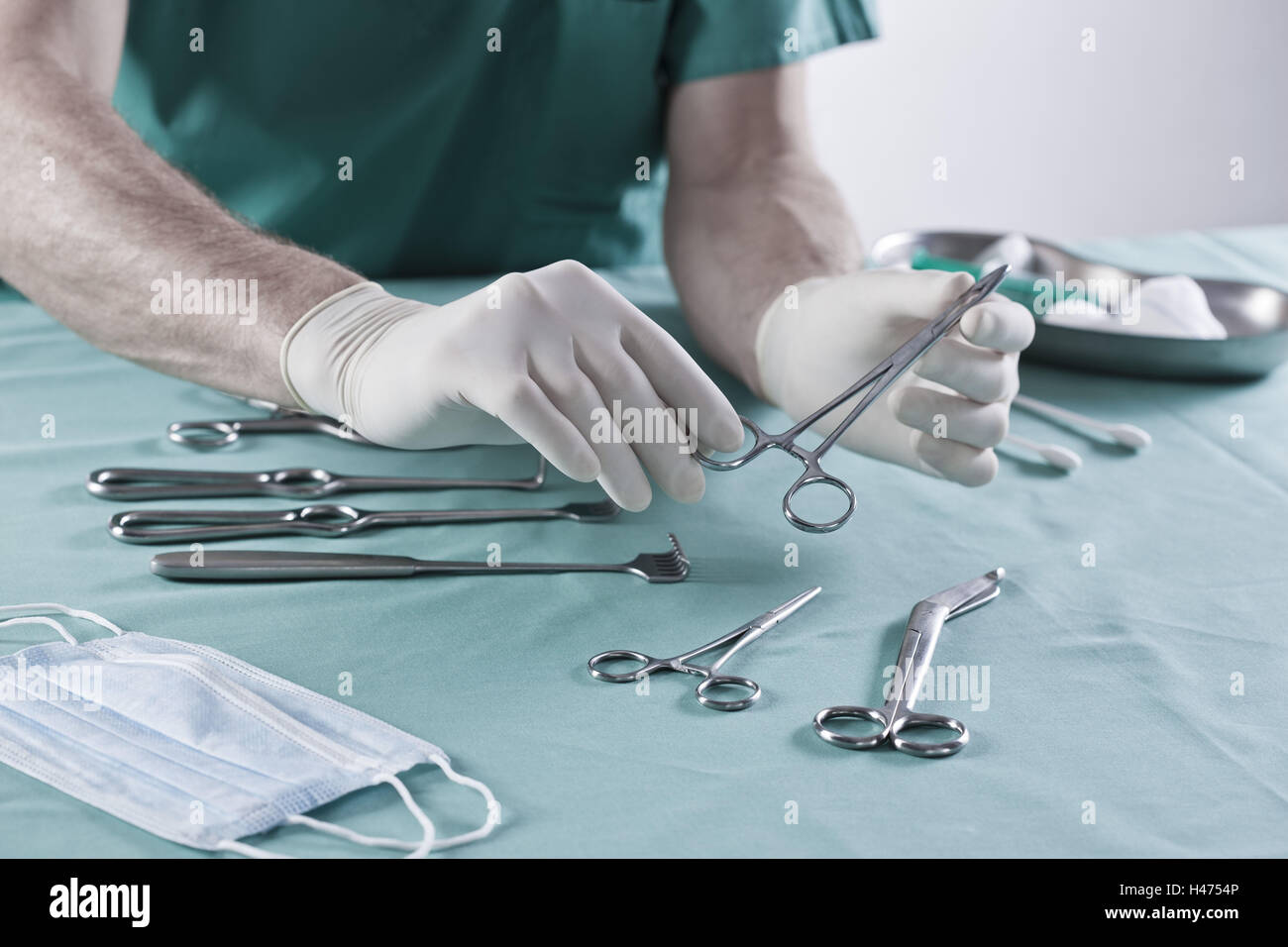 Op. doctor, gloves, instruments, prepare, check, medium close-up ...