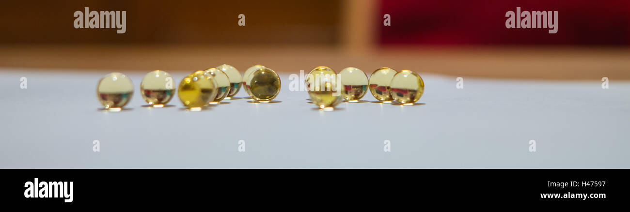 Yellow translucent round Golden balls. Fish ROE, oil Stock Photo - Alamy